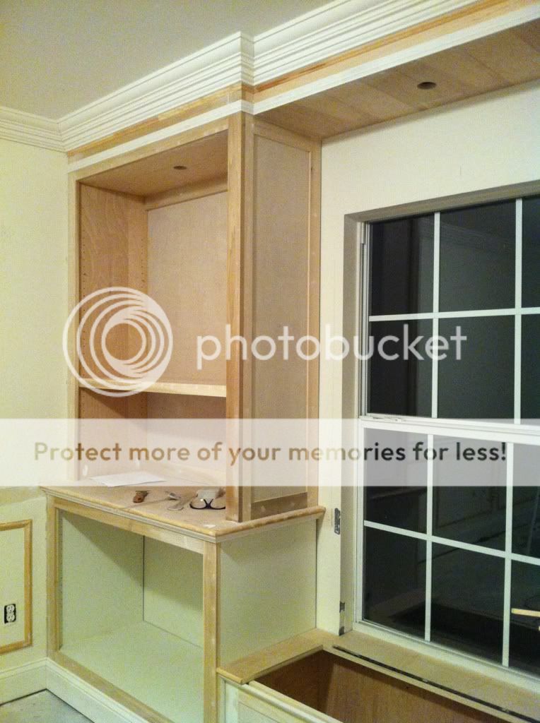 Lower cabinet upper bookcase flanking window seat built-in construction ...