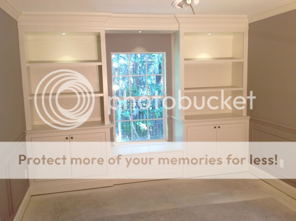 Lower cabinet upper bookcase flanking window seat built-in construction ...